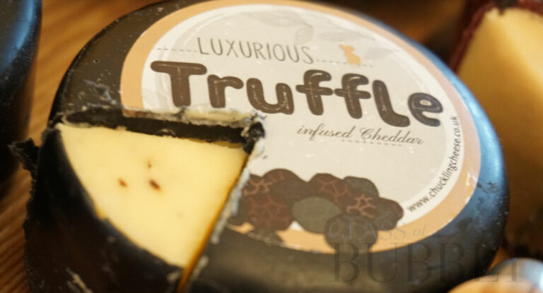 Chuckling Cheese and Champagne – Glass Of Bubbly